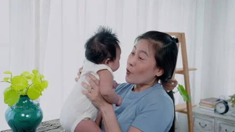 4K, Asian single mom, holding up his dau... | Stock Video | Pond5