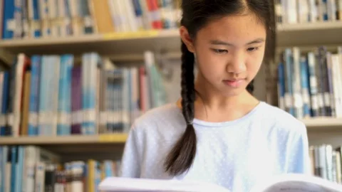 4K Asian teenager student reading a book... | Stock Video | Pond5