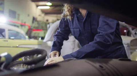 4K Attractive female mechanic working on... | Stock Video | Pond5