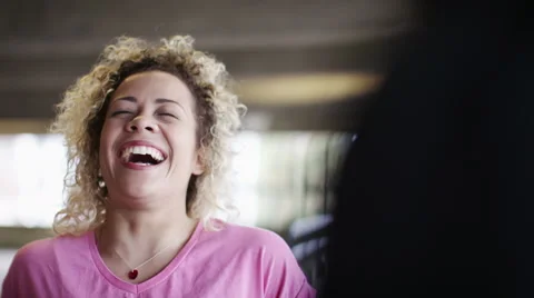 4K Attractive female in a pink top talks... | Stock Video | Pond5