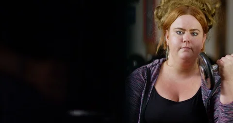 4K Beautiful plus size woman lifting wei... | Stock Video | Pond5