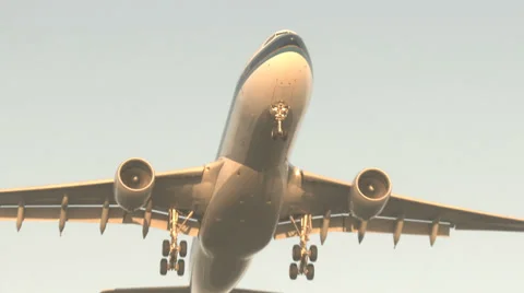 4K Big jet flying overhead at sunrise | Stock Video | Pond5