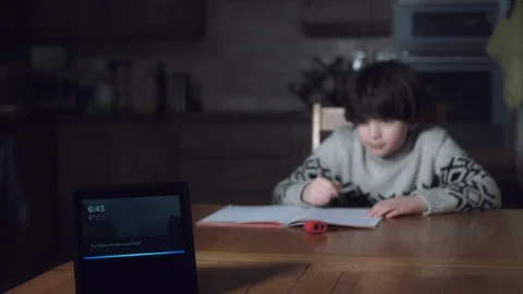 4K Boy Doing Homework with Smart Home De... | Stock Video | Pond5