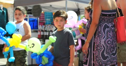 4K boys children holding alien shaped ba... | Stock Video | Pond5