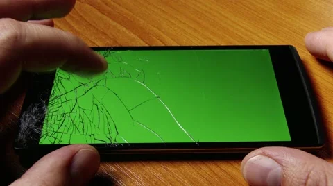 4K Broken Screen Smartphone with Green B... | Stock Video | Pond5
