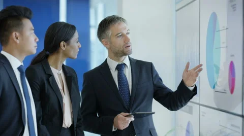 4K Business group in discussion, looking... | Stock Video | Pond5