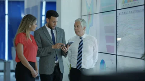 4K Business group in discussion, looking... | Stock Video | Pond5