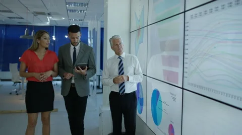 4K Business group in discussion, looking... | Stock Video | Pond5