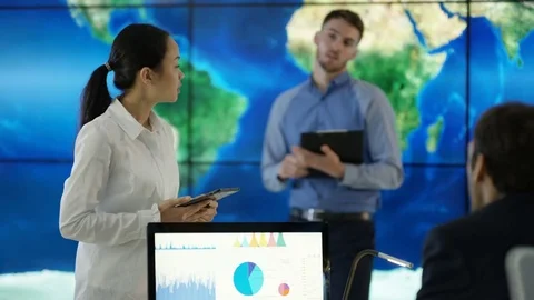 4K Business team discussing large world... | Stock Video | Pond5