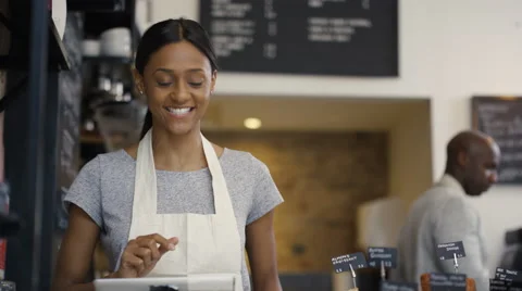 4K Cheerful worker serving a customer wh... | Stock Video | Pond5