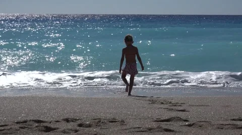 4K Child Kid Playing in Waves, Little Gi... | Stock Video | Pond5