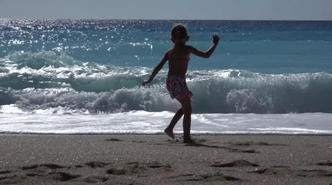 4K Child Kid Playing in Waves, Little Gi... | Stock Video | Pond5