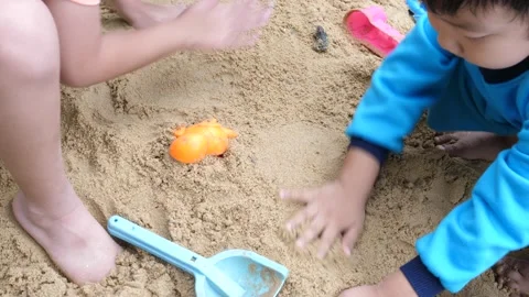 4K Children's hand playing sand together... | Stock Video | Pond5