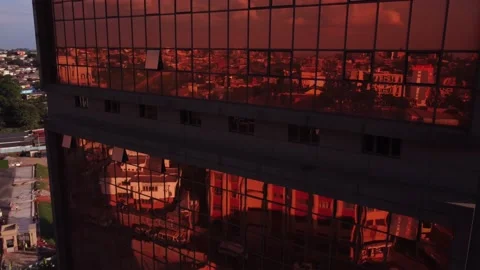 4k Circling of Orange glass building dow... | Stock Video | Pond5