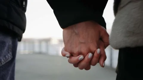 4K Close-up people in love hold hands ag... | Stock Video | Pond5