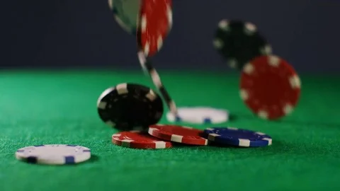 4K Colorful poker chips falling onto gre... | Stock Video | Pond5
