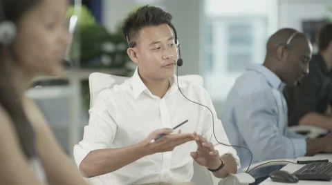 4K Customer service ops taking calls in ... | Stock Video | Pond5
