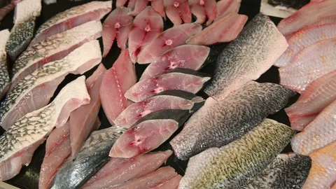 4K Different fresh sliced raw fish on th... | Stock Video | Pond5