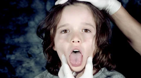 4k Dramatic Shot of a Sick Child Being E... | Stock Video | Pond5