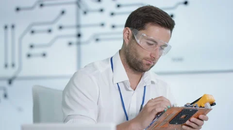 4K Electronics engineer working in lab b... | Stock Video | Pond5