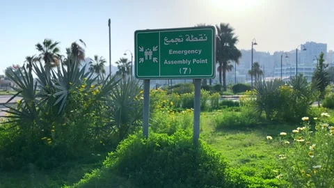 4K Emergency Assembly Point Sign Amid Lu... | Stock Video | Pond5