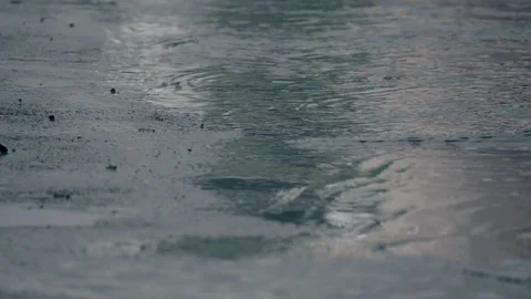 4K establishing shot of rain falling on ... | Stock Video | Pond5