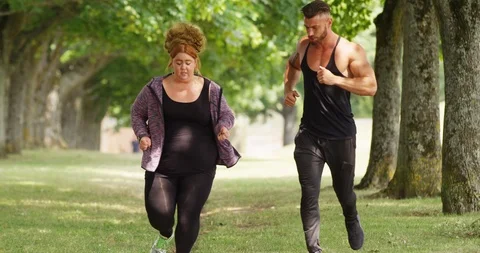 4K Exhausted overweight woman running in... | Stock Video | Pond5