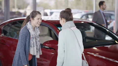 4K Female friends in car dealership take... | Stock Video | Pond5
