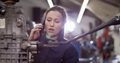 4K Female mechanic rebuilding engine & t... | Stock Video | Pond5