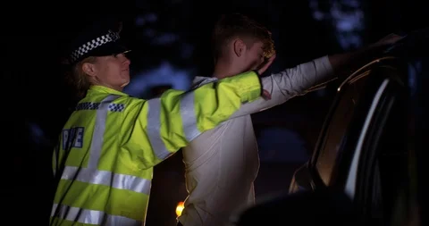 4K Female police officer arresting & han... | Stock Video | Pond5