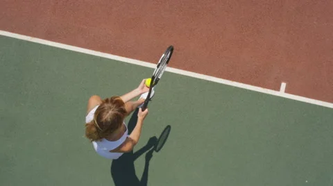 4K Female tennis player throws ball into... | Stock Video | Pond5