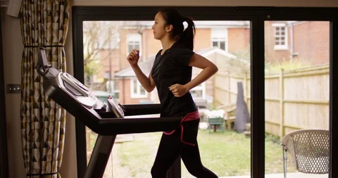 4K Fit & motivated young woman running o... | Stock Video | Pond5