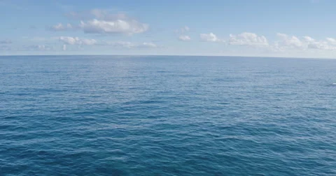 4K Flying Low Over Ocean Revealing Sea C... | Stock Video | Pond5