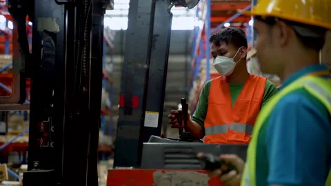 4K, Forklift driver operates a forklift ... | Stock Video | Pond5