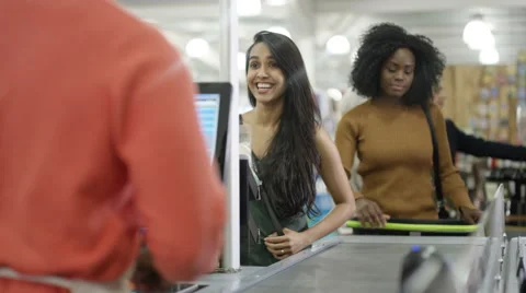 4K Friendly cashier taking payment from ... | Stock Video | Pond5