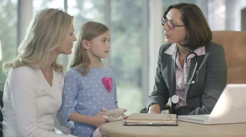 4K Friendly doctor talking to parent and... | Stock Video | Pond5