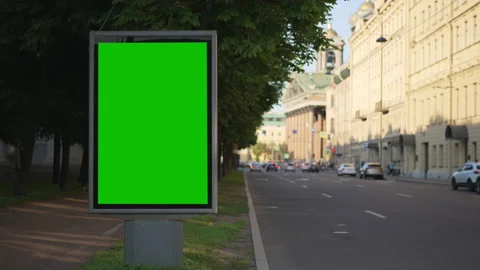4k Green billboard stands and cars drive... | Stock Video | Pond5