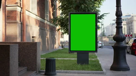 4k Green billboard stands on street and ... | Stock Video | Pond5