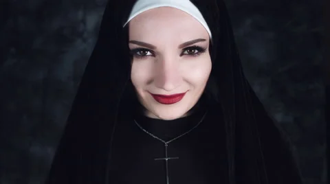 4k Halloween Shot of a Horror Nun Smilin... | Stock Video | Pond5