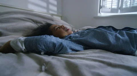 4K Happy little boy lying down on bed at... | Stock Video | Pond5