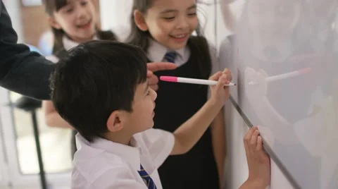 4K Happy school children in class writin... | Stock Video | Pond5