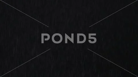 4k Heavy angled rain falling in front of the camera against black ...
