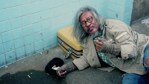 4K, A homeless Asian man lying on a dirt... | Stock Video | Pond5