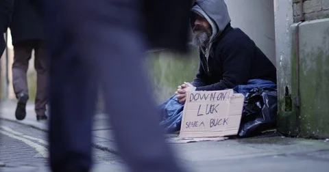 4k, Homeless man with a cardboard sign s... | Stock Video | Pond5