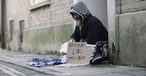 4k, Homeless man sitting on a street wit... | Stock Video | Pond5