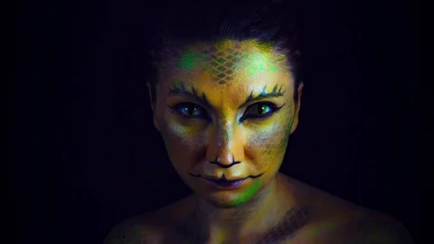 4K Horror Serpent Makeup Woman uncovers ... | Stock Video | Pond5