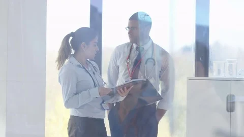 4K Hospital doctors in a meeting discuss... | Stock Video | Pond5