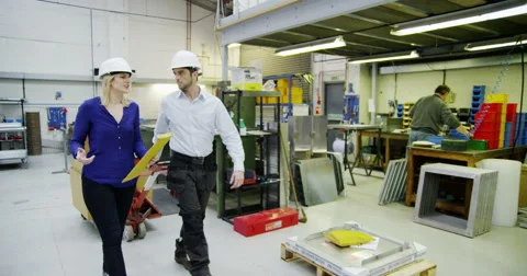 4K Industrial workers talking as they wa... | Stock Video | Pond5