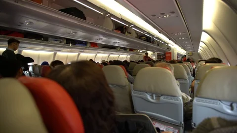 4k Interior airplane rows seats with pas... | Stock Video | Pond5