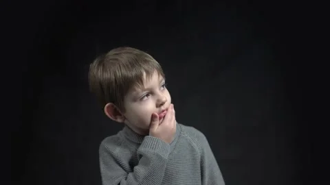 4k Kid think or compos on black backgrou... | Stock Video | Pond5